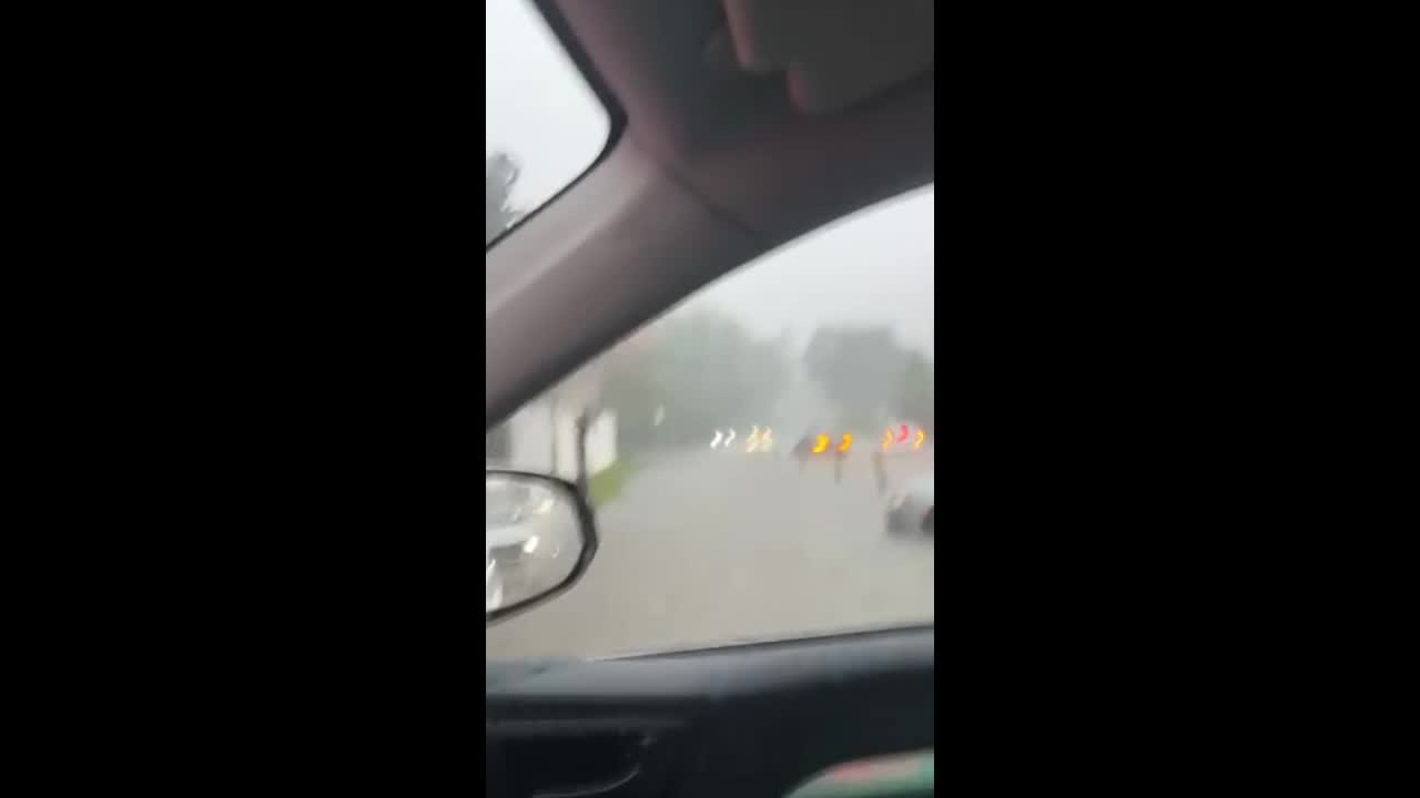 Heavy rain and hail flood streets in Pierrefonds, Quebec, Canada