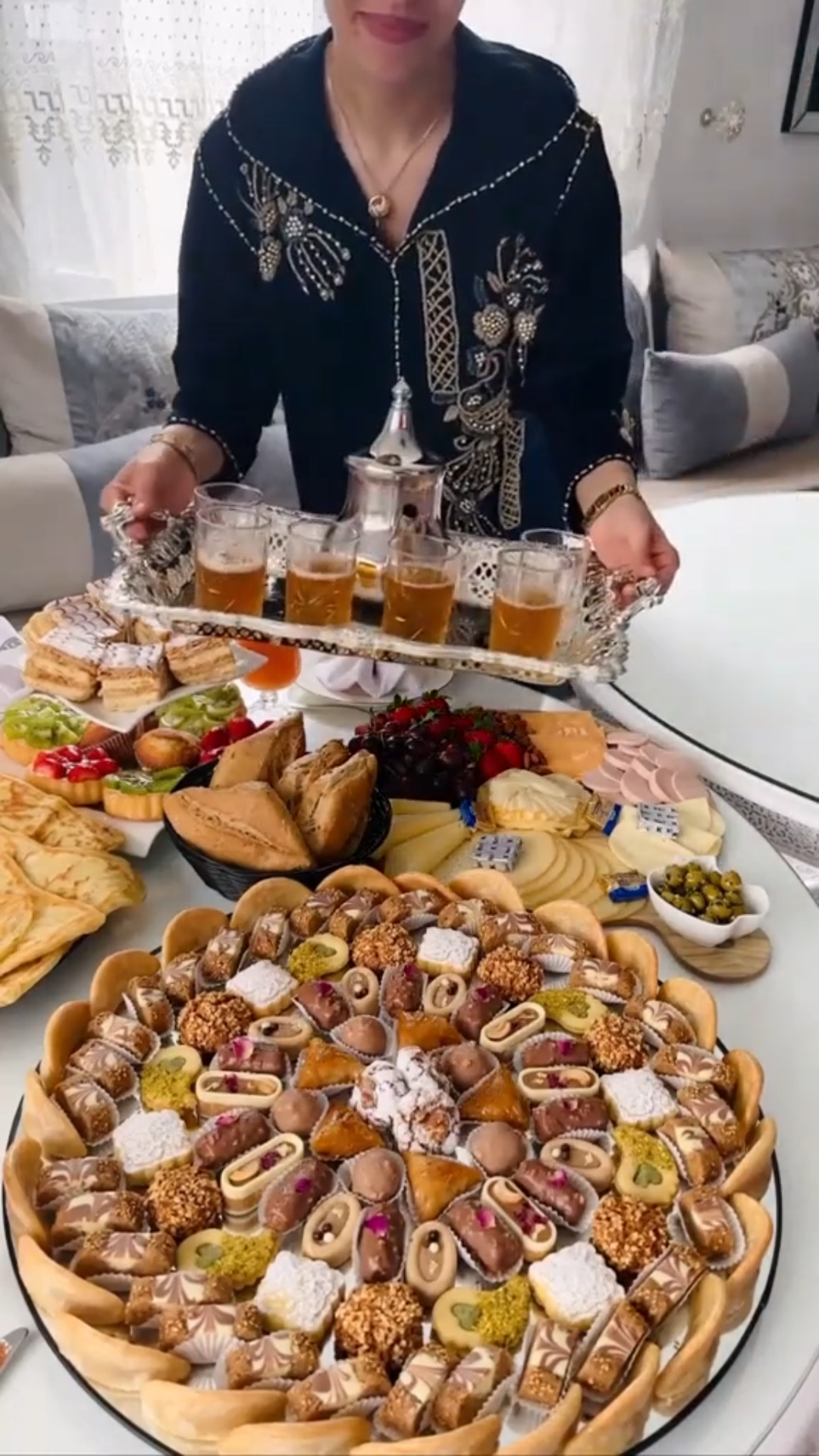 Traditional Middle Eastern dessert platter with tea and sweet treats