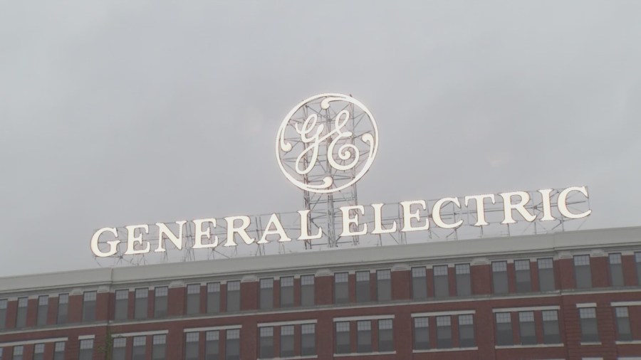 Officials gather to light up General Electric sign