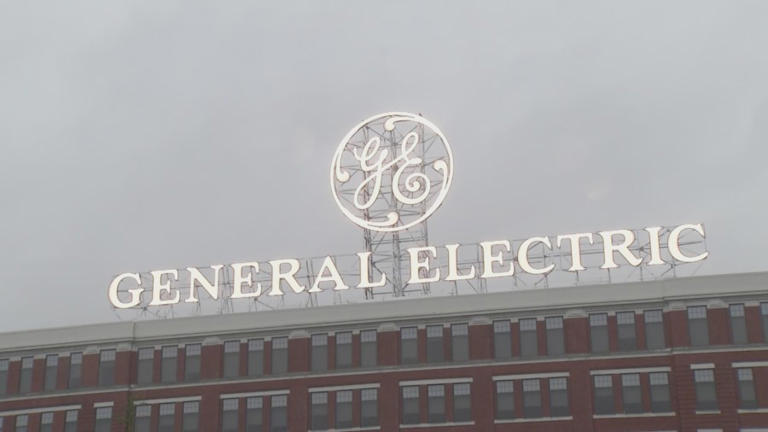 Officials gather to light up General Electric sign