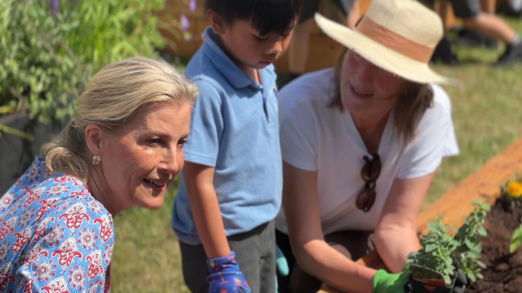 Duchess helps school plant show garden flowers