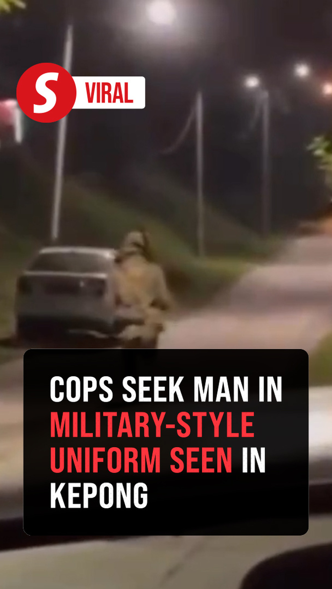 Police hunt man in military uniform seen with rifle in viral video