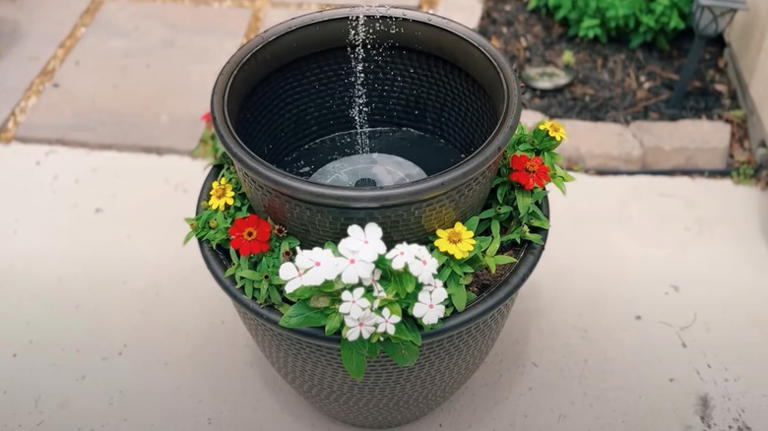 Repurpose old plastic nursery pots into a solar garden fountain