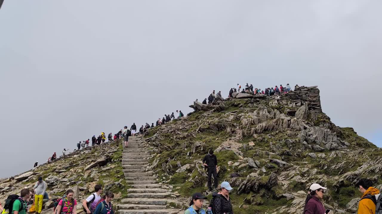Hikers queue almost an hour for Snowdon summit selfies despite peak ...