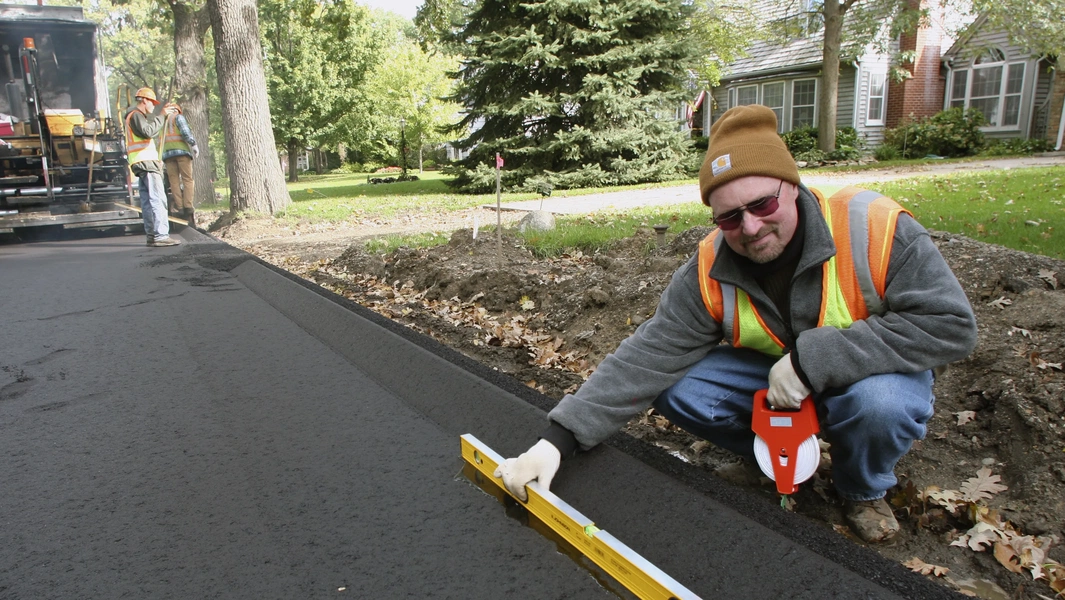 Asphalt remains cheaper than concrete but with shorter lifespan