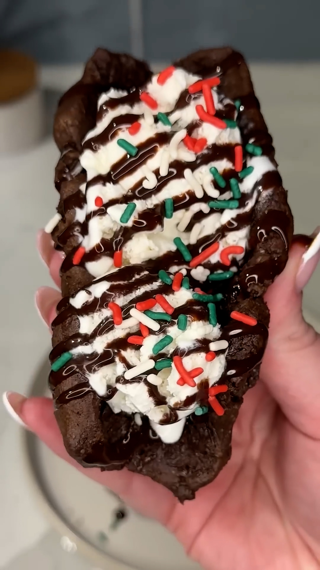 Cookies shaped into crunchy taco shells and loaded with ice cream
