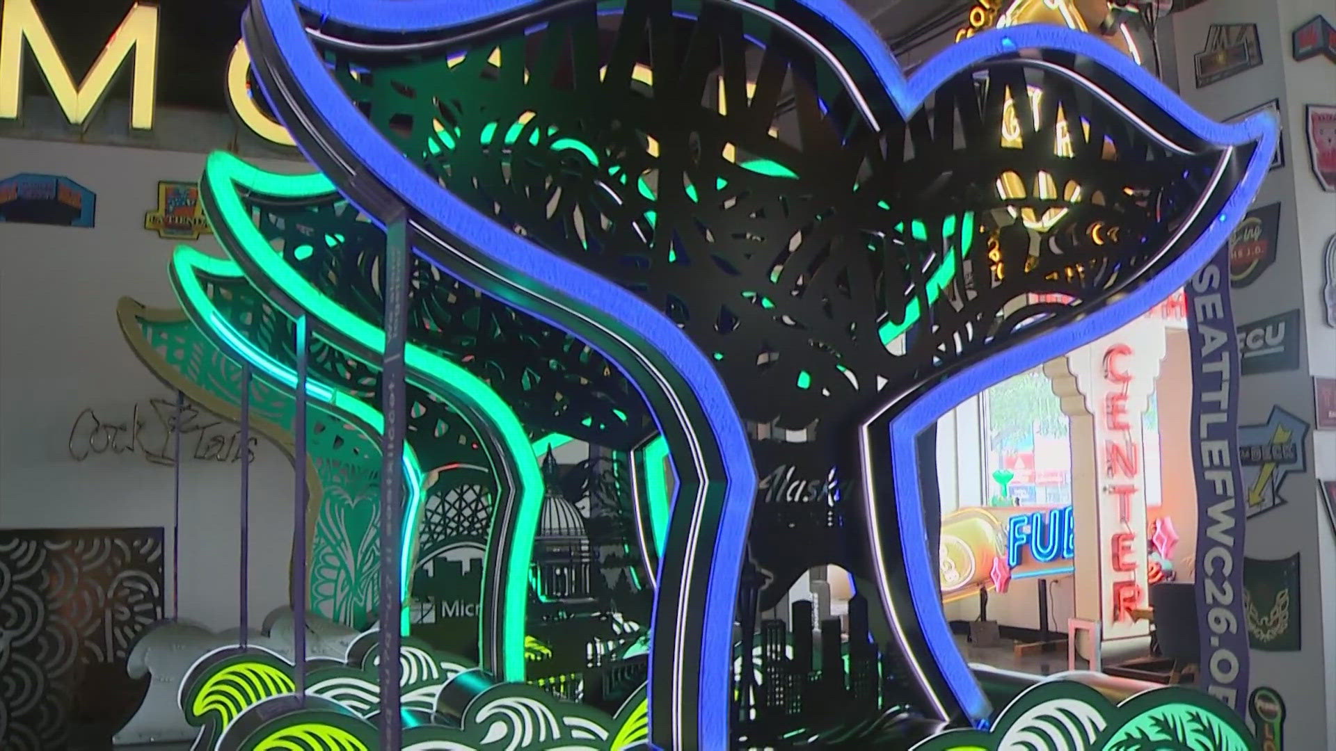 Seattle's first neon art gallery creates whale tails for FIFA World Cup
