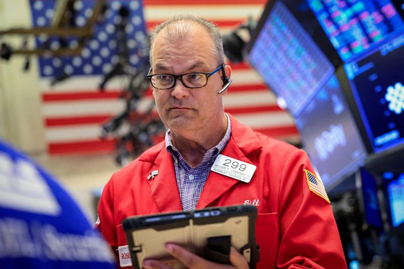 Wall Street ends lower on semiconductor selloff as AI spending concerns ...