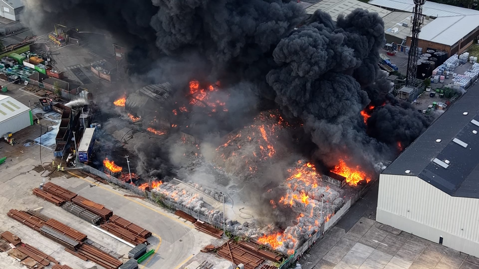Massive recycling centre fire sends flames into night sky in England