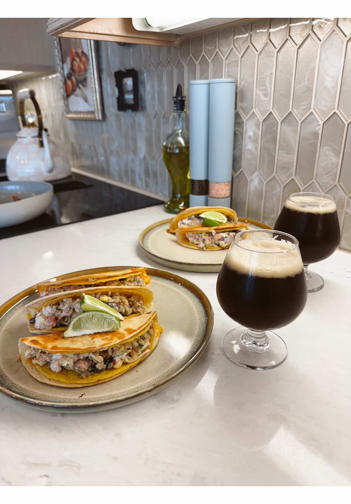 Cooking cheesy rice and black bean quesadillas paired with a rich dark ...