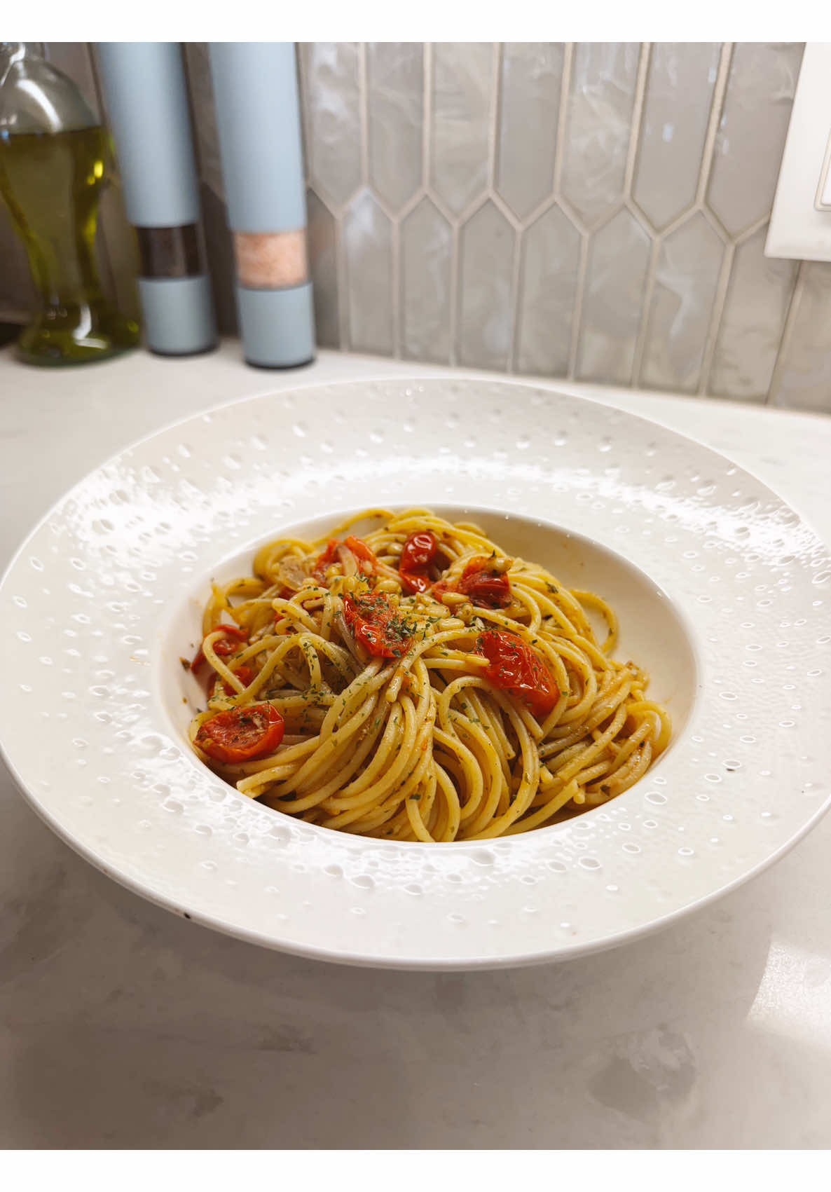 Making simple spaghetti with blistered roasted cherry tomatoes and ...