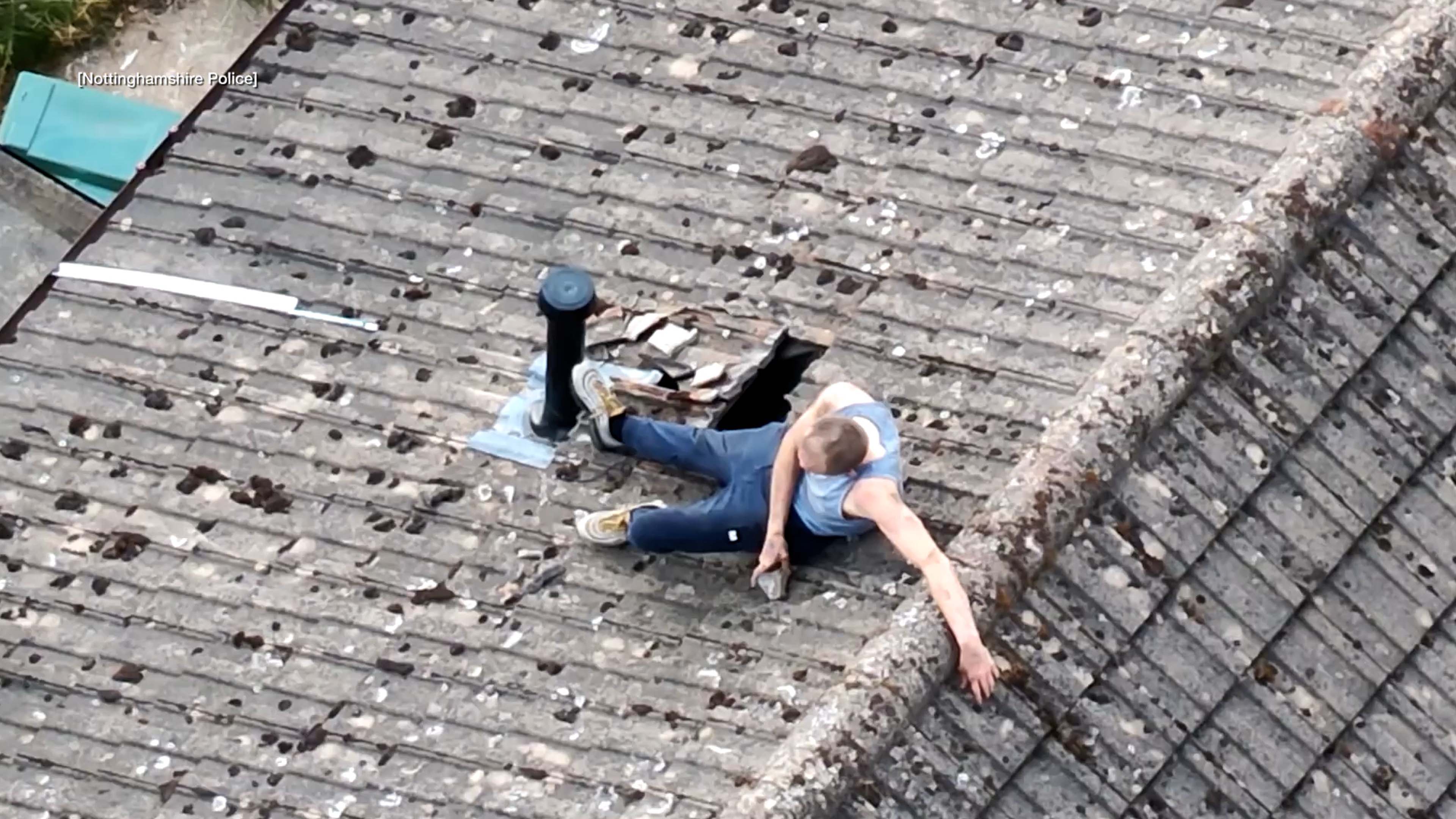 Robber hurls roof tiles at cops and lies down in four-hour siege