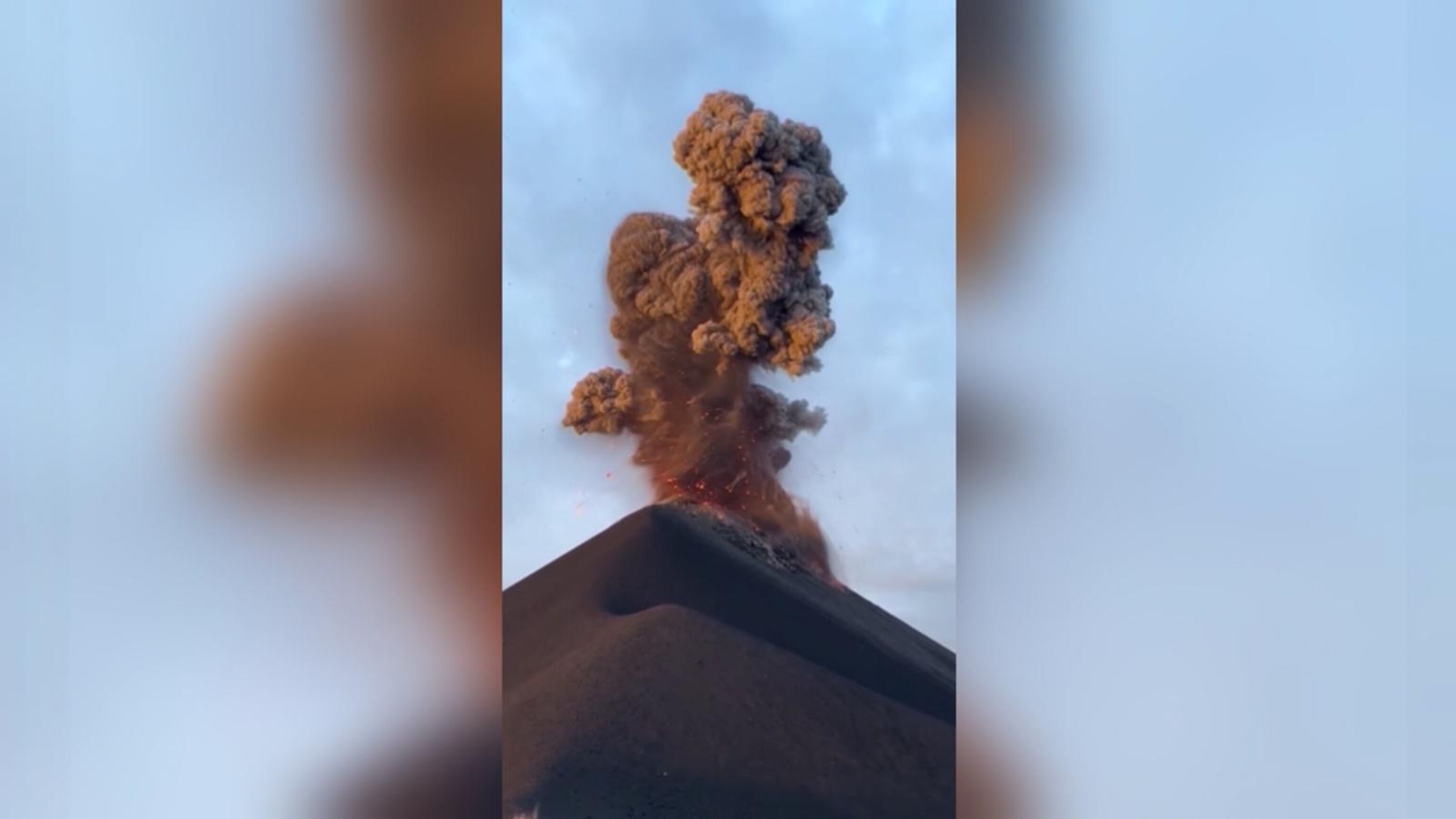Tourists flee erupting volcano