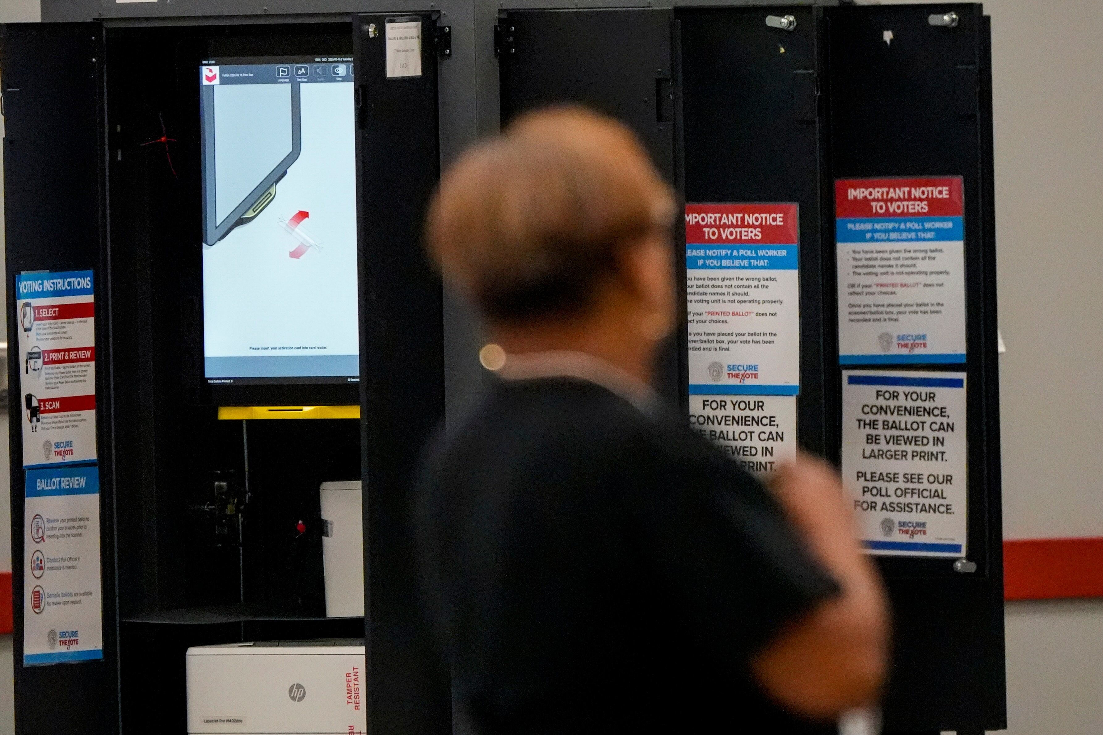 Ga. runoff ballots get hand count as Kemp signs new recount rules