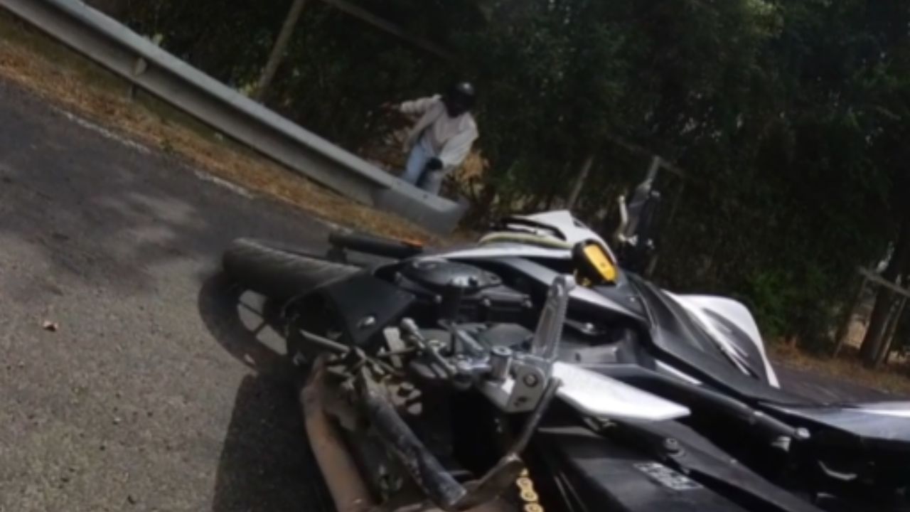 Bike rider crashes into a containment barrier on a fast turn