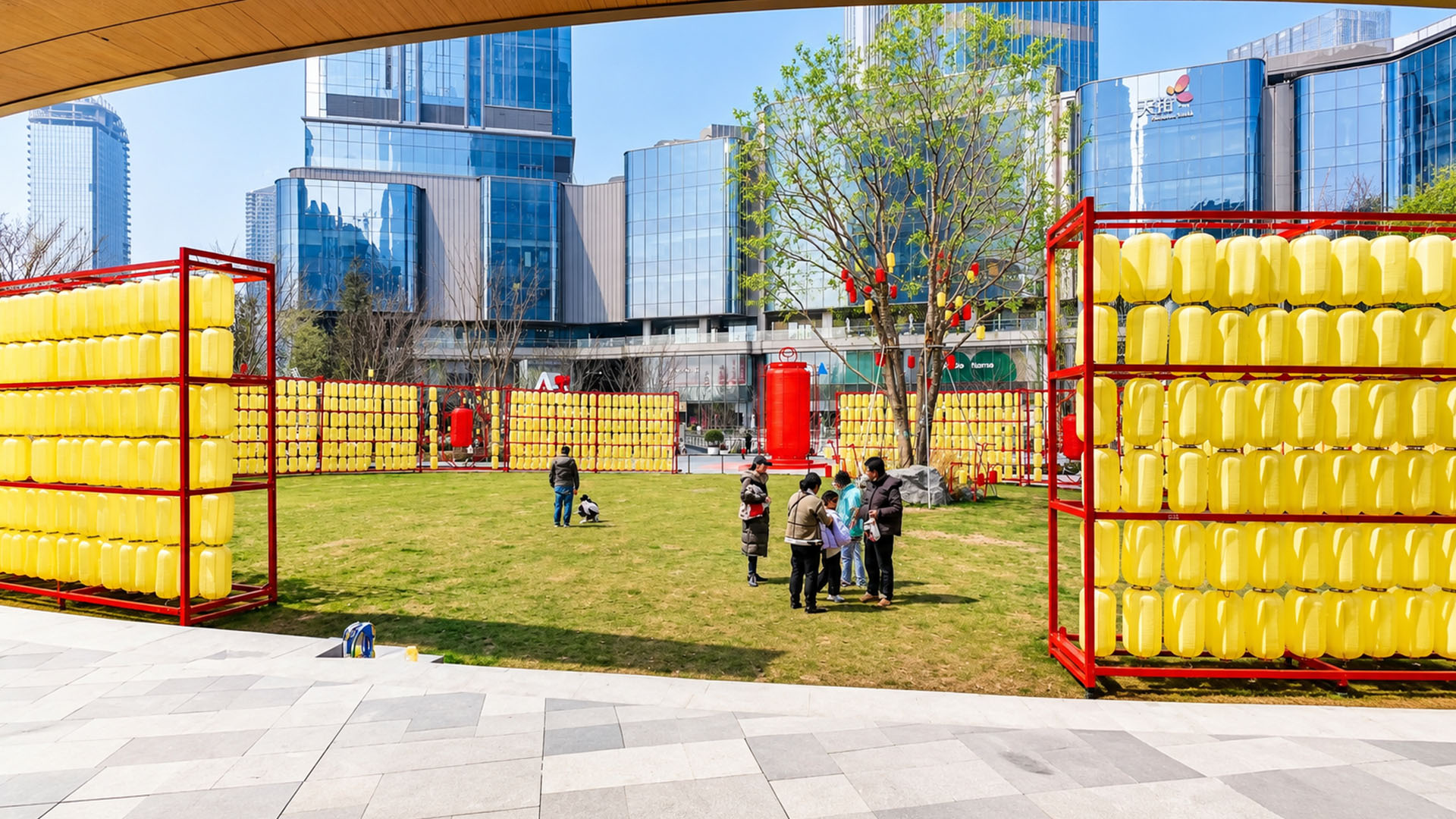 Giant yellow lantern walls turn this Chinese lawn into spectacle