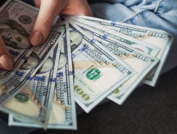 Oil drops, houses freeze, and Americans keep spending: Inside the ...