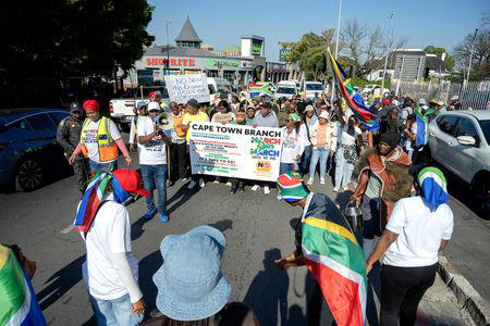 Police look on as anti-foreigner marchers vandalise businesses, join ...