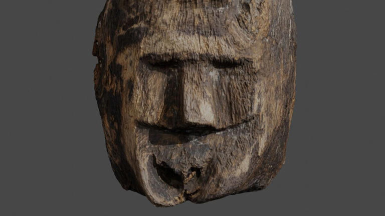 Underwater archaeologists stumble upon a haunting carved face preserved ...