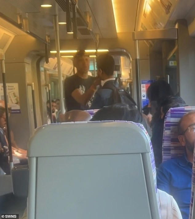 Moment Tube passengers rush to man's defence after he is slapped by ...