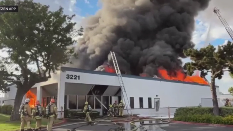 Orange County firefighters battle third-alarm blaze at Santa Ana ...