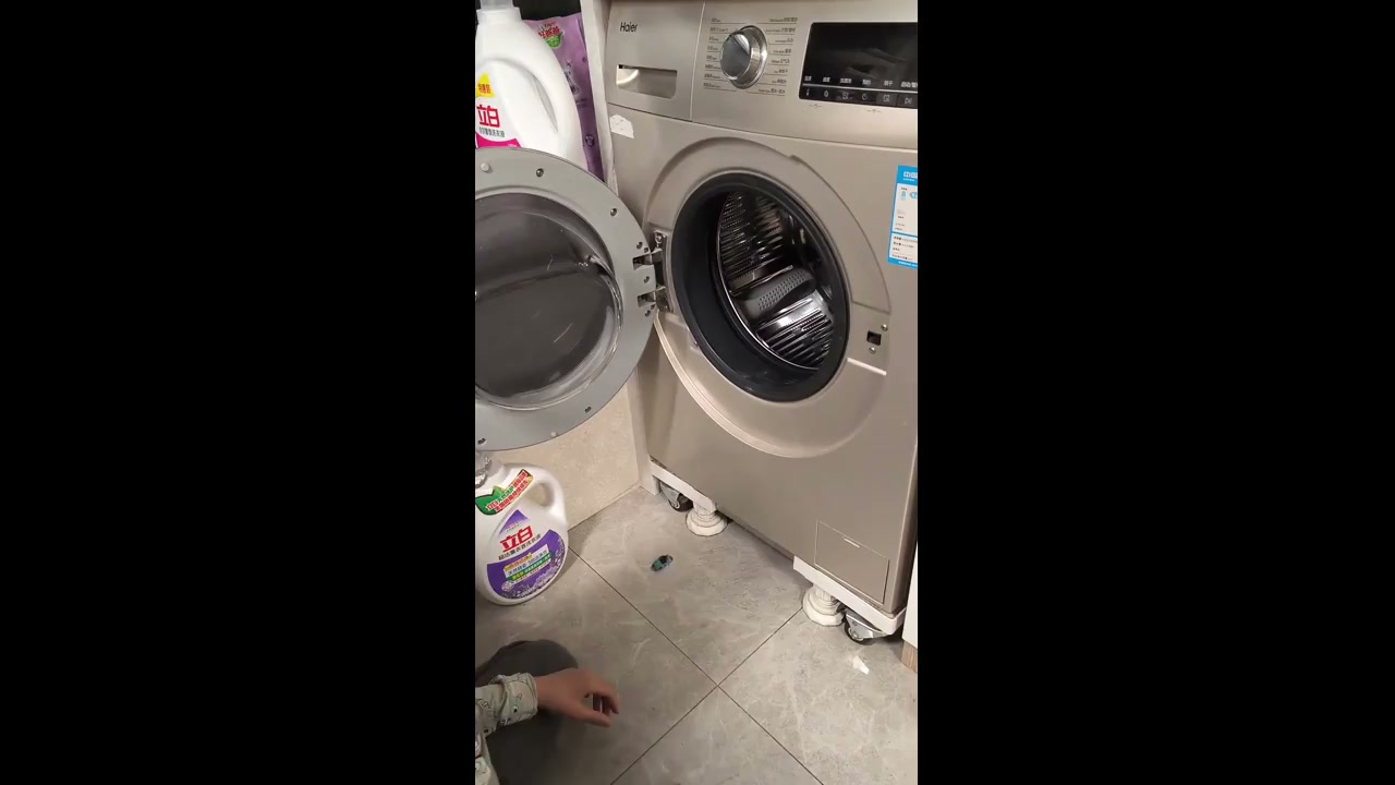 Boy spins toy car in washing machine for fun
