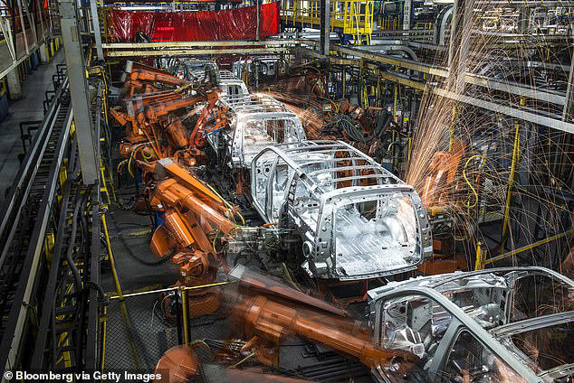GM replaces more than 1,000 workers with just 50 robots at flagship ...