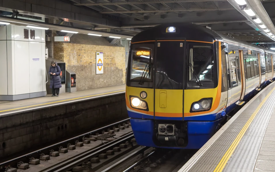 Driver on phone as train left with ramp attached