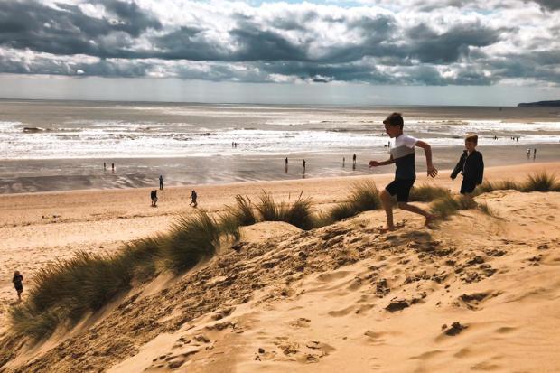 The sandy beach with a nearby castle ranked among the best to visit ...