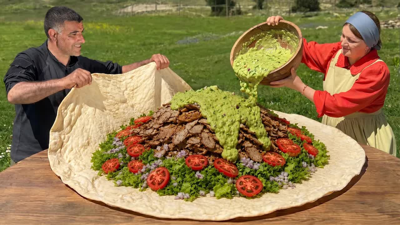 This giant shawarma burrito kept turning over the fire for hours