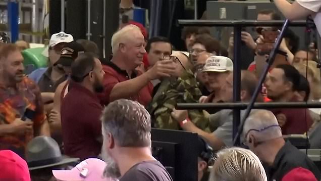 Moment heckler attacked by crowd after yelling 'peadophile' at Trump event