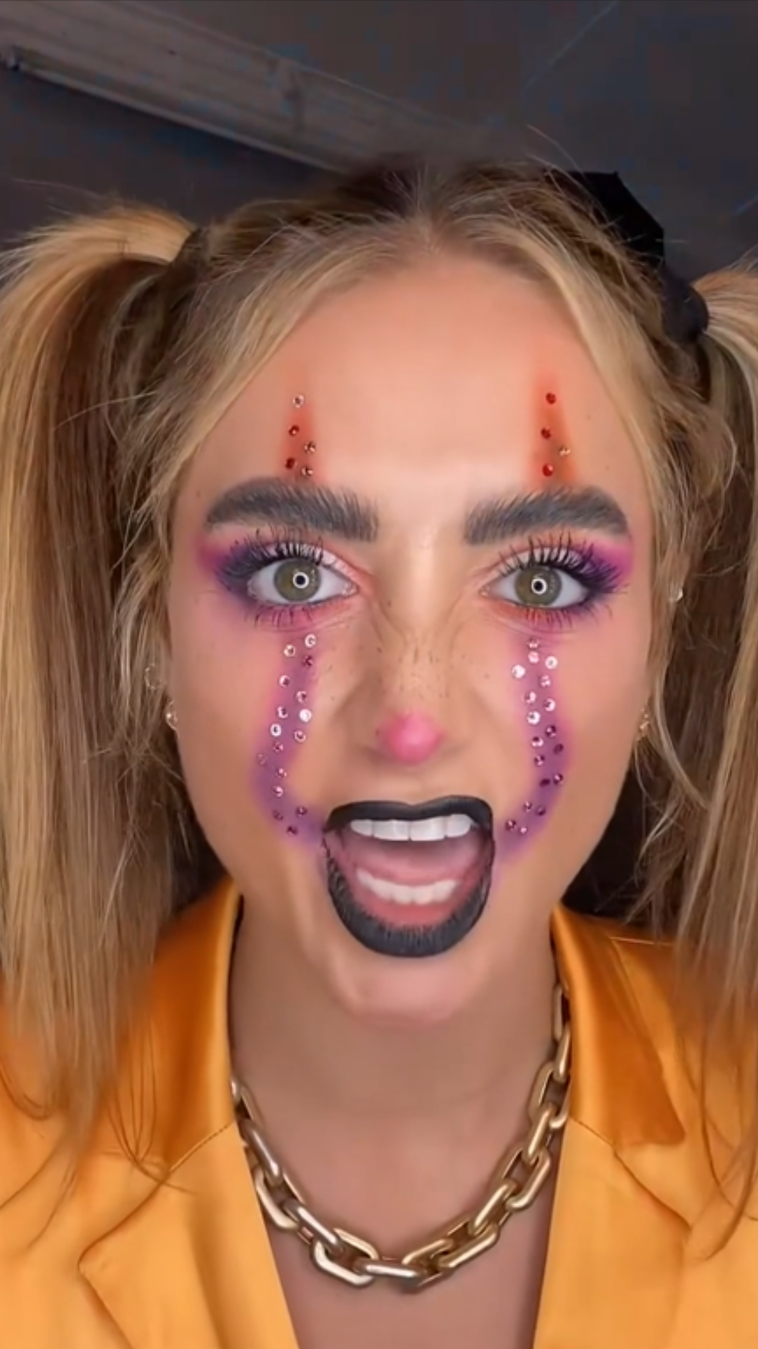The dramatic clown cheek makeup style taking over social