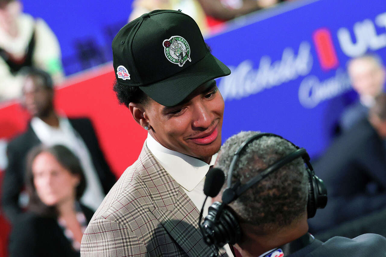 UH's Chris Cenac Jr. waits before going to Boston Celtics at No. 27 ...