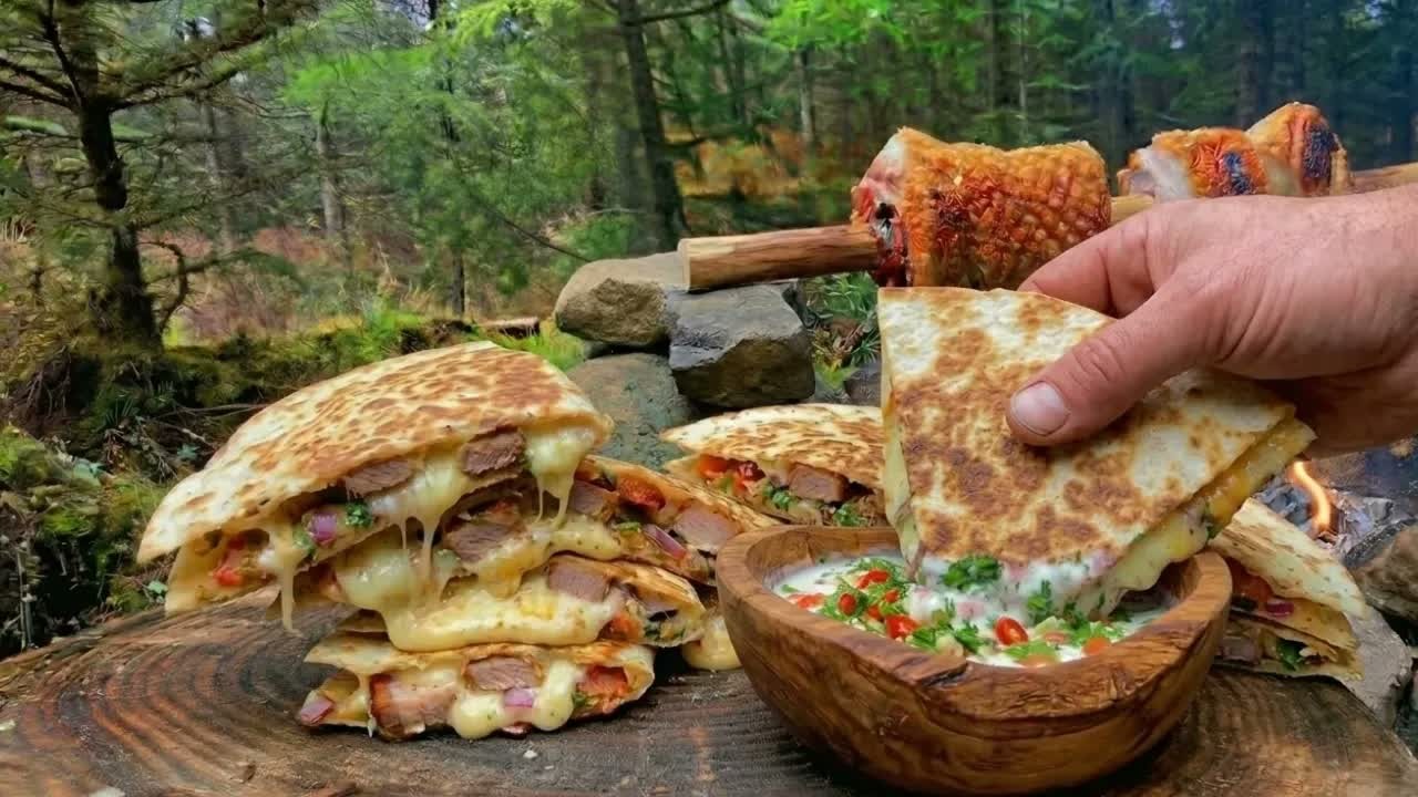 Watch how this pork belly quesadilla crisps up over open fire
