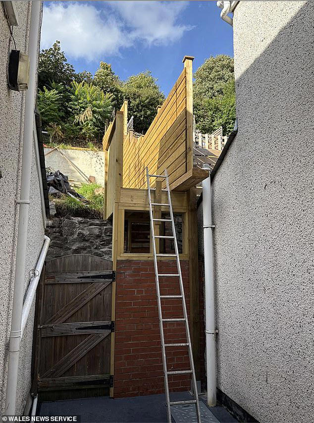 Homeowner ordered to tear down 'overbearing' wooden bridge he built to ...