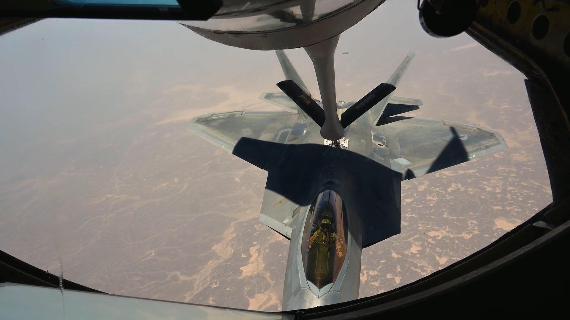 F-22 Raptors refuel mid-air during strategic mission