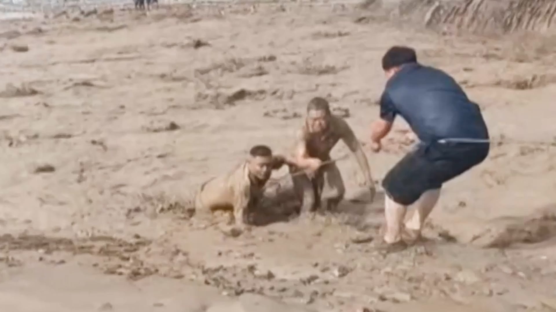 Herders rescue two people after SUV swept away by flash flood in China