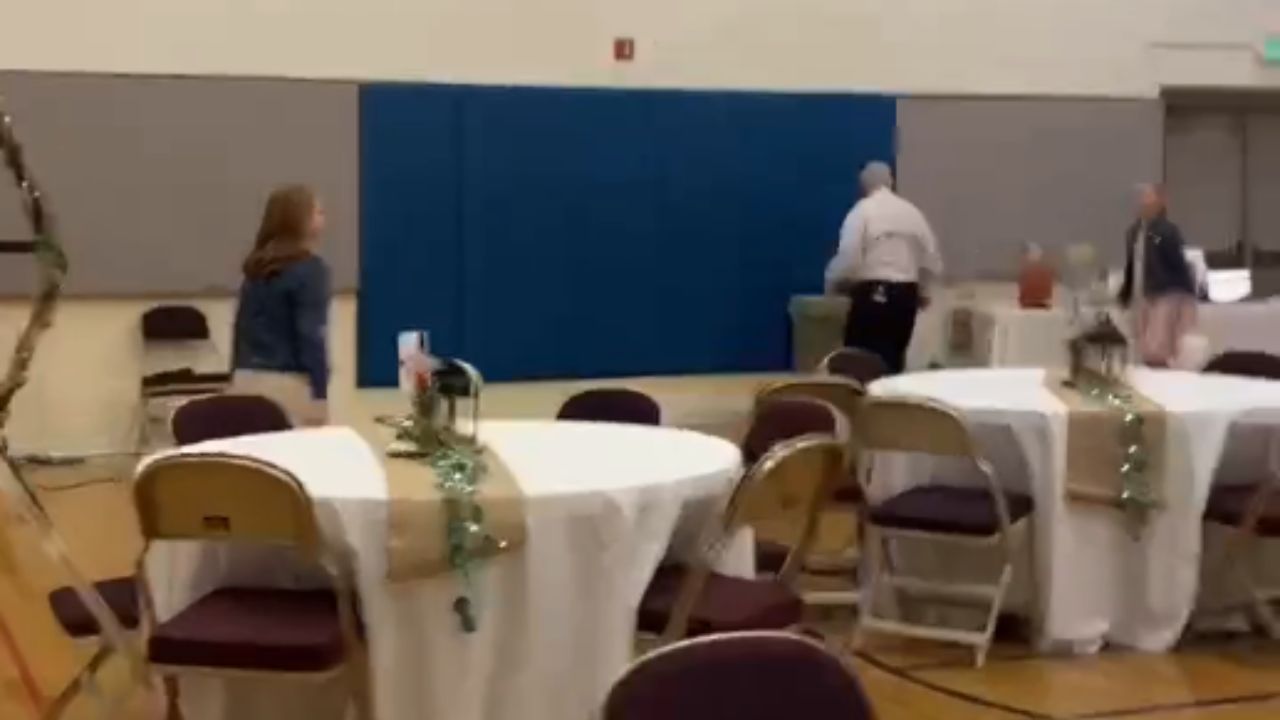 Woman surprises the bridal party of her flower girl with a sweet reunion