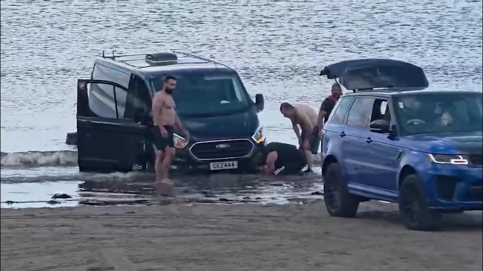 Range Rover worth £120,000 is swallowed by rising tide when trying to ...