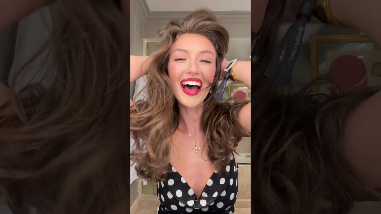 Model has fun singing along to a classic rock hit