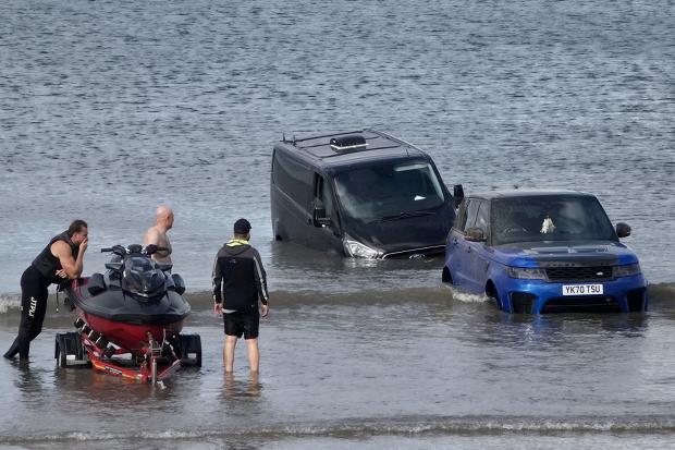 Watch - £120k luxury car becomes stuck in North Yorkshire sea after ...