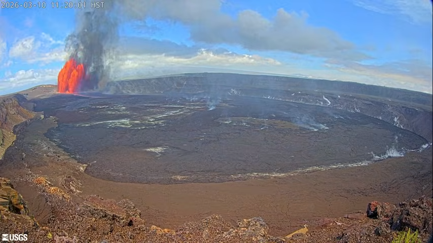 Watch lava fountains light up a glowing crater as tephra falls