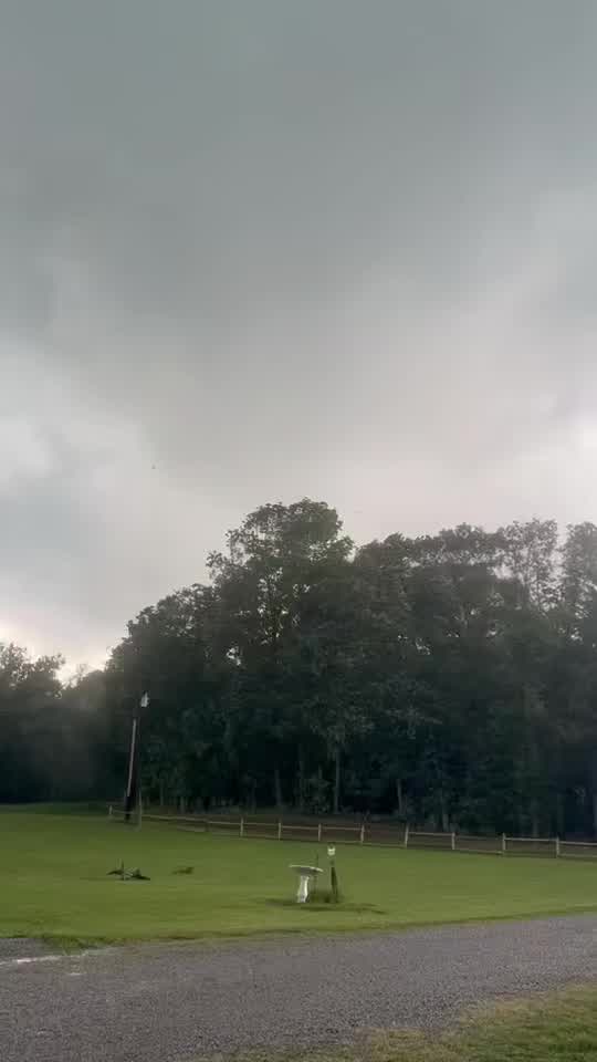 Funnel cloud forms behind Illinois home amid deadly storms