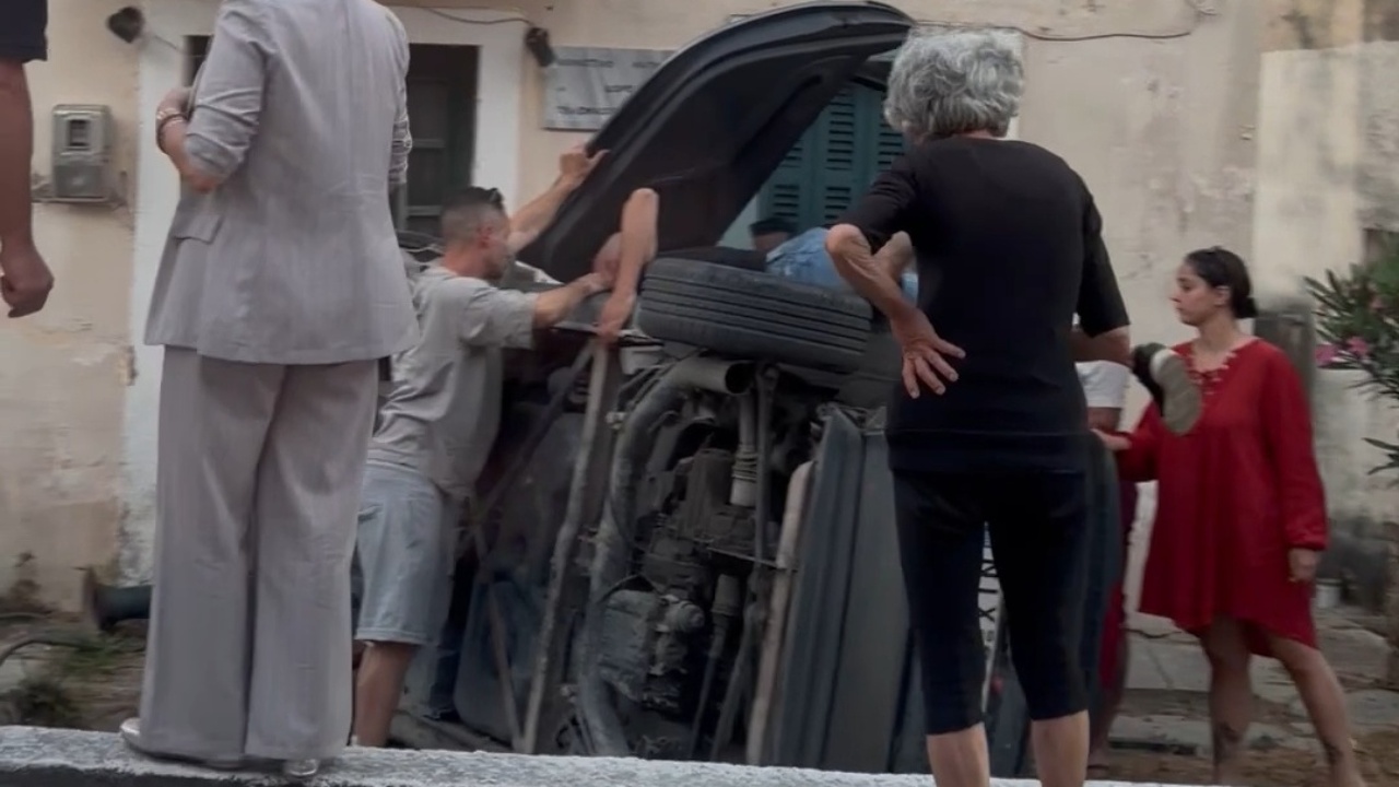 Overturned car seen on a roadside in Corfu
