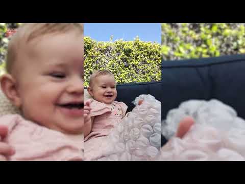 Toddler giggles at bubble wrap pops