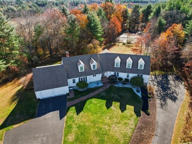 This contemporary cape in Bedford was built on 6-plus acres in Riddle ...