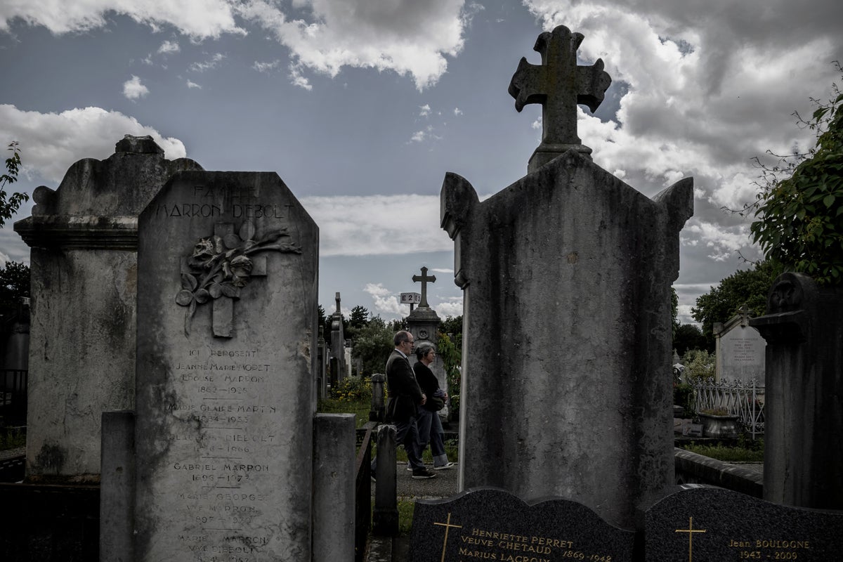 Botched funeral ends with mortuary worker sitting on open casket: suit