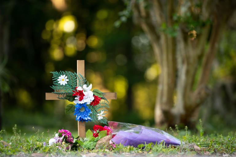 Botched funeral ends with mortuary worker sitting on open casket: suit