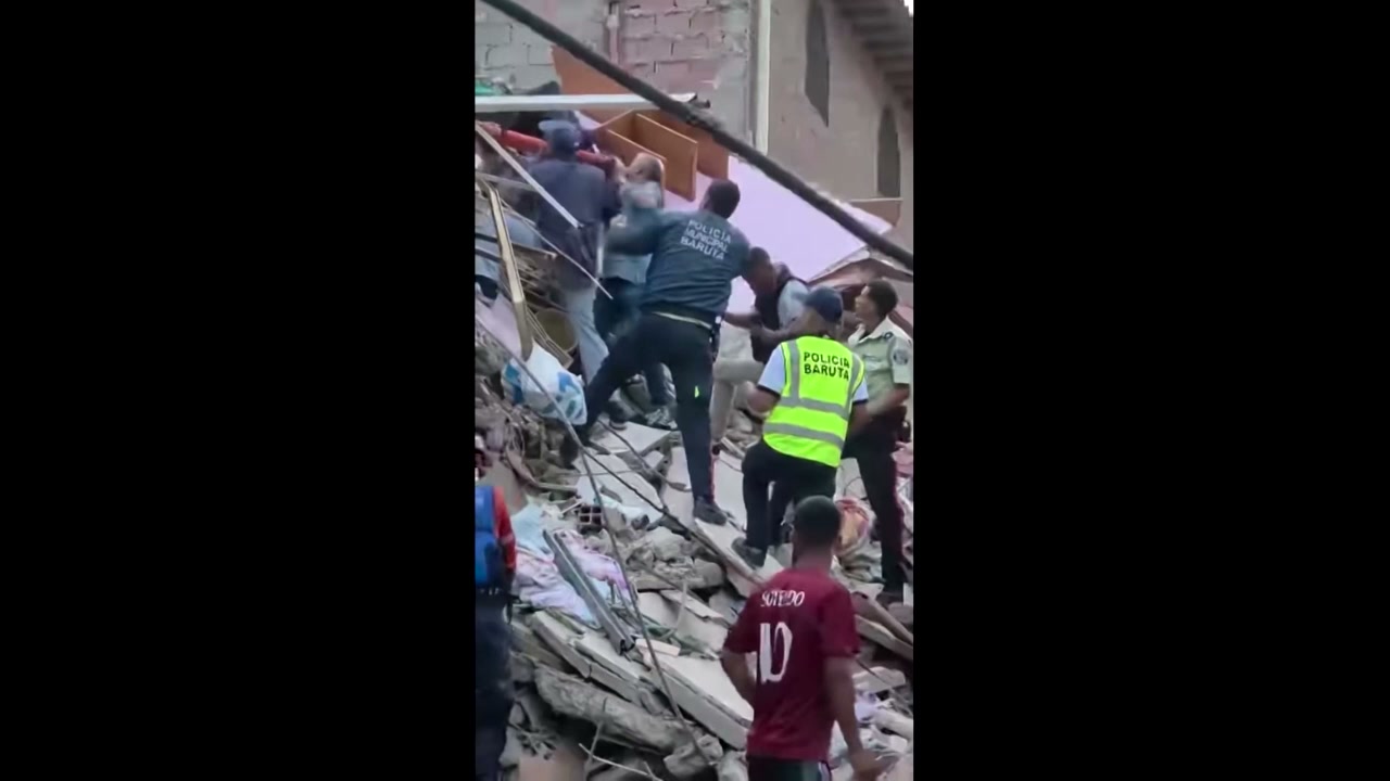 Rescue workers carry people out on stretcher after earthquake in Venezuela
