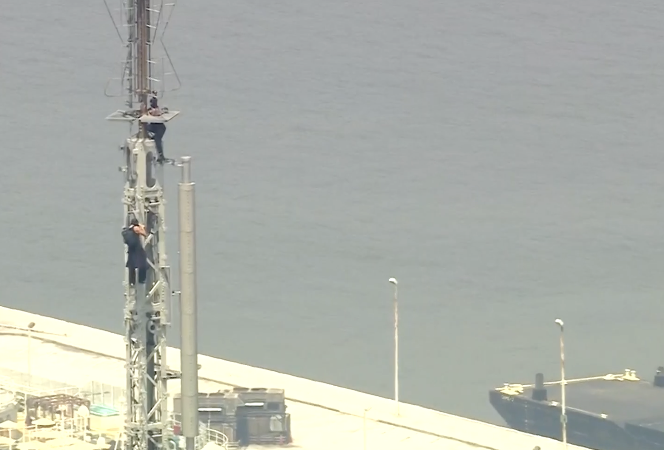 2 people flew banner at top of Empire State Building